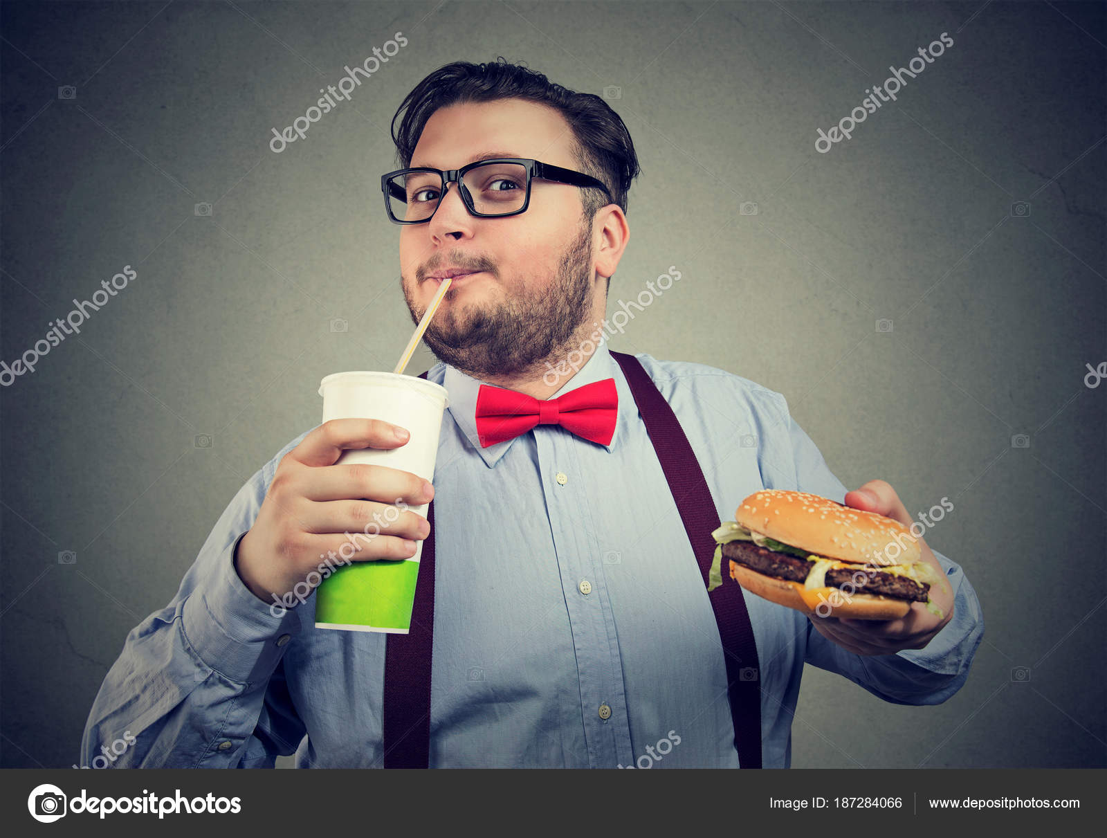 Excited overweight man eating fast food — Stock Photo © SIphotography ...