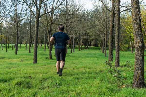 Big belly man jogging , exercising, doing. - Stock Image - Everypixel
