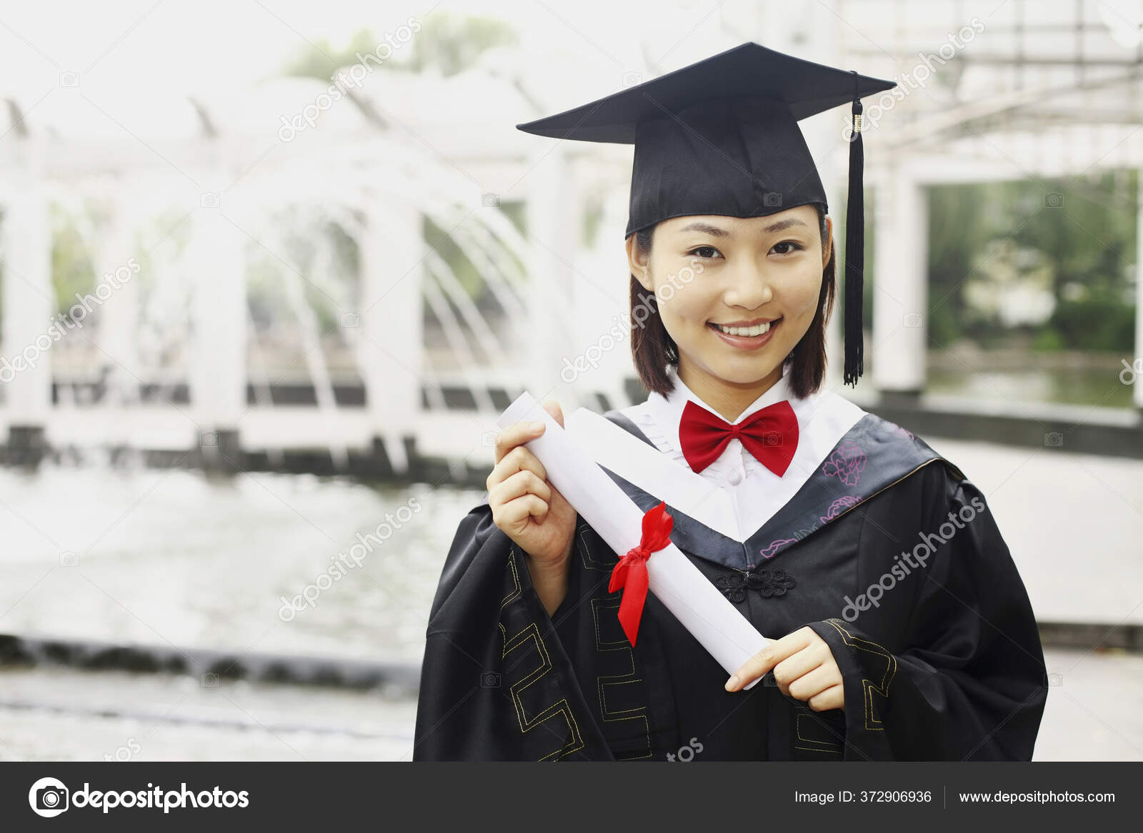 Woman Graduation Robe Posing Camera — Stock Photo © image_hit #372906936