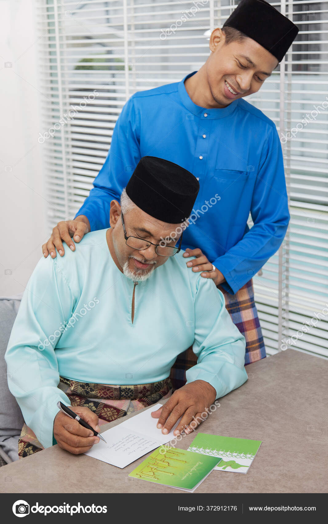 Muslim Man Writing Greeting Card His Son Stock Photo by ©image_hit ...