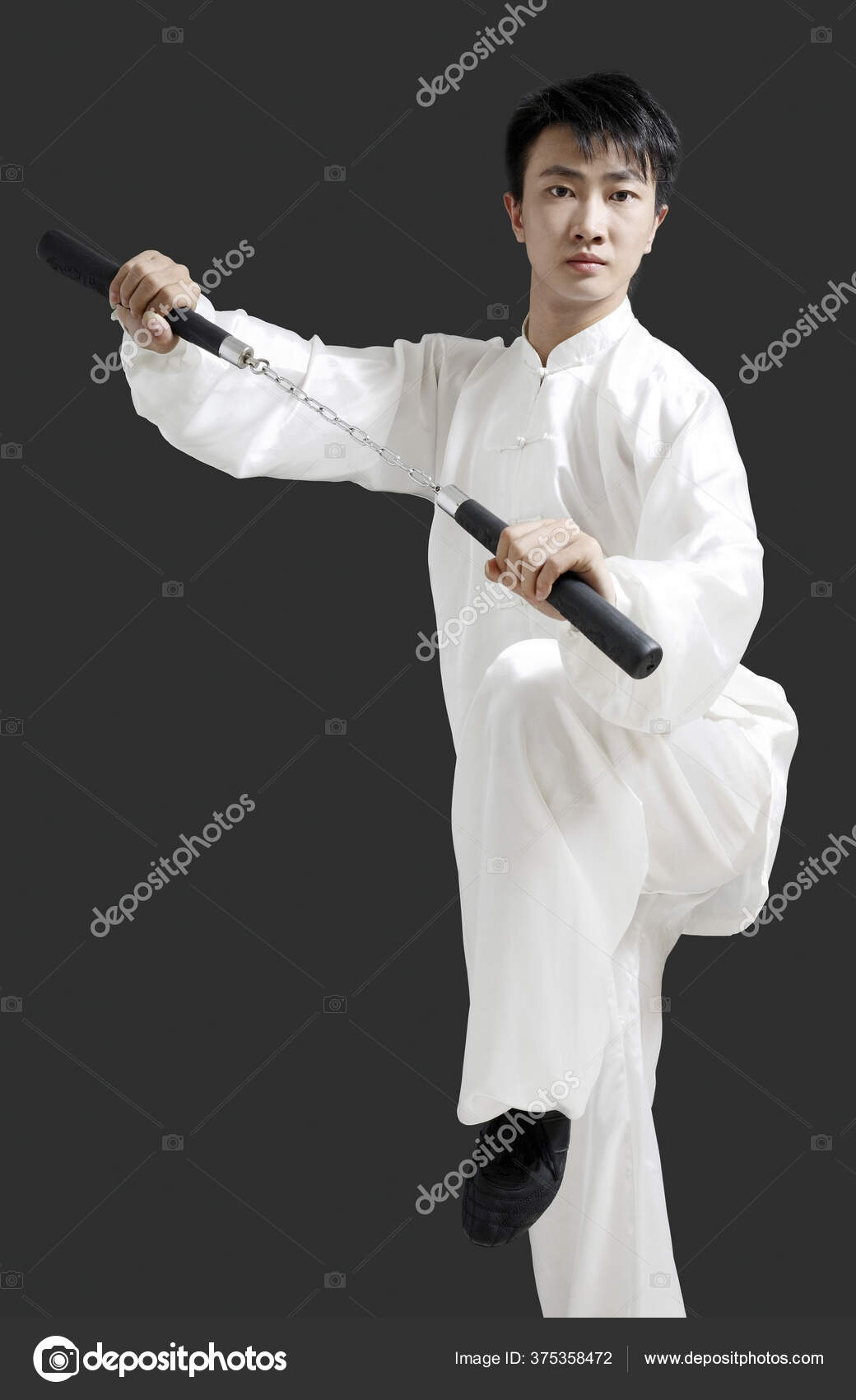 Man Nunchaku Striking Pose Camera — Stock Photo © image_hit #375358472