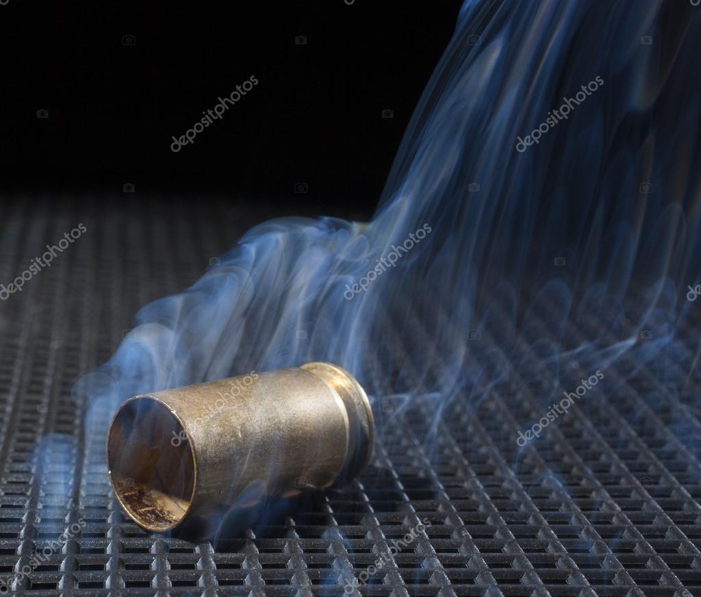 Handgun round smoking Stock Photo by ©gsagi 125488586