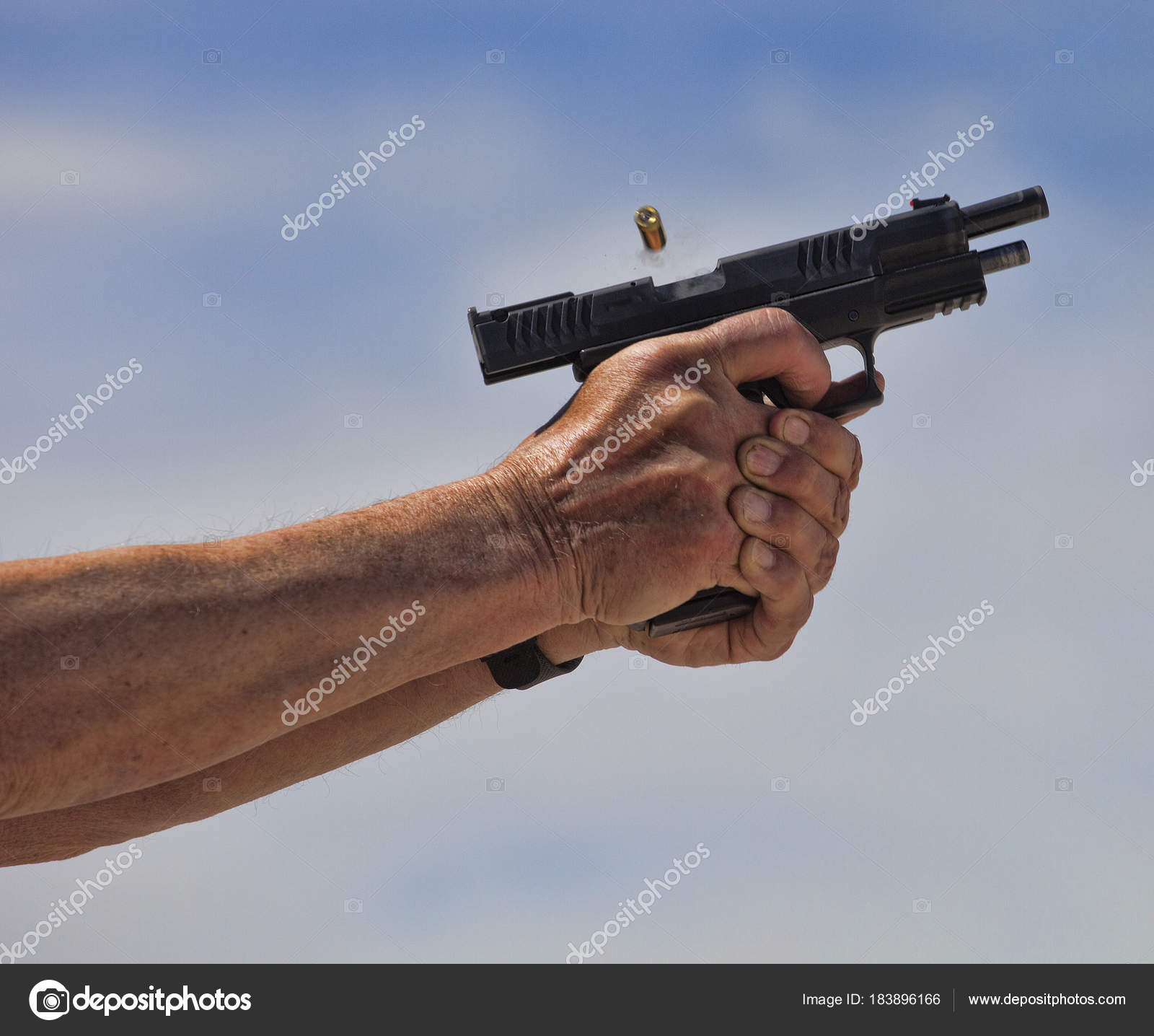 Shell and smoke leaving a handgun just after being shot — Stock Photo ...