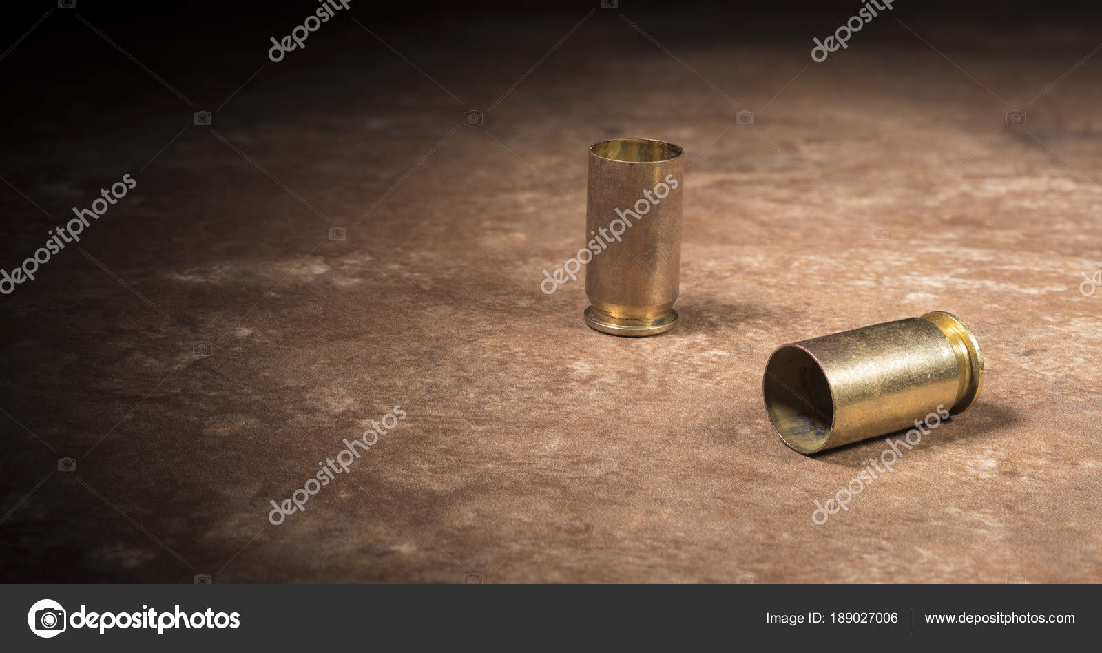 45 caliber handgun casings sitting on the floor Stock Photo by ©gsagi ...