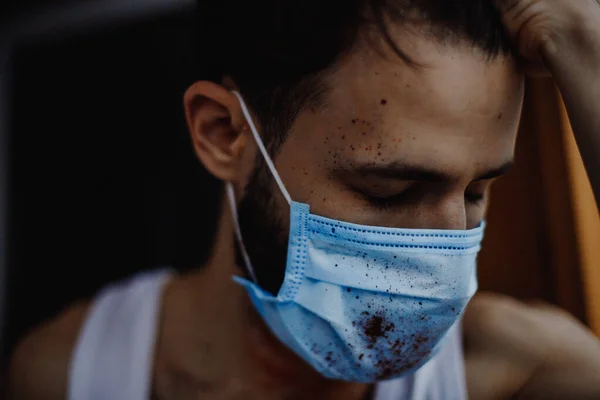 portrait of a coronavirus patient alone in isolation, having a nervous ...