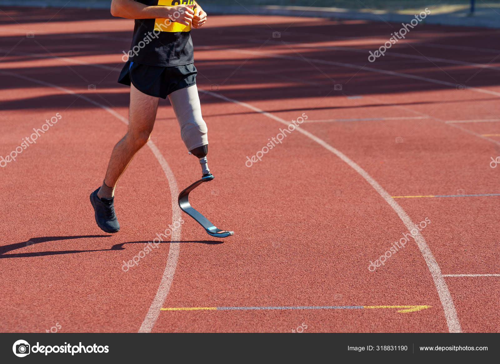 Man with prosthetic leg running at a stadium Stock Photo by ©YGphoto ...