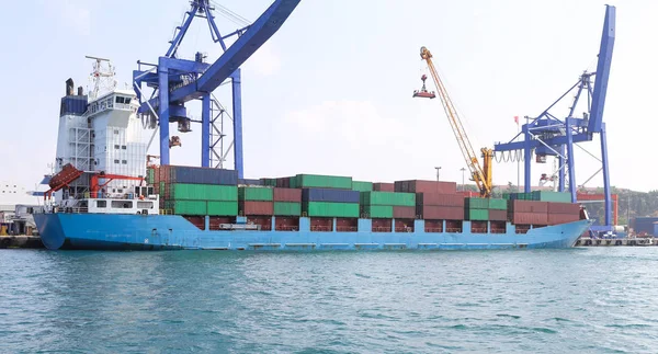 Container ship loading and unloading in deep sea port, Aerial to ...