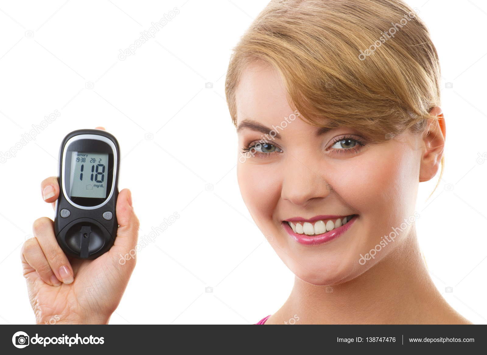 Happy woman holding glucometer, checking and measuring sugar level ...
