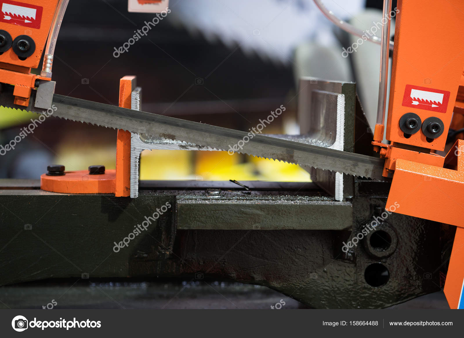 Automatic band saw cutting tool steel bar by automatic feed — Stock ...