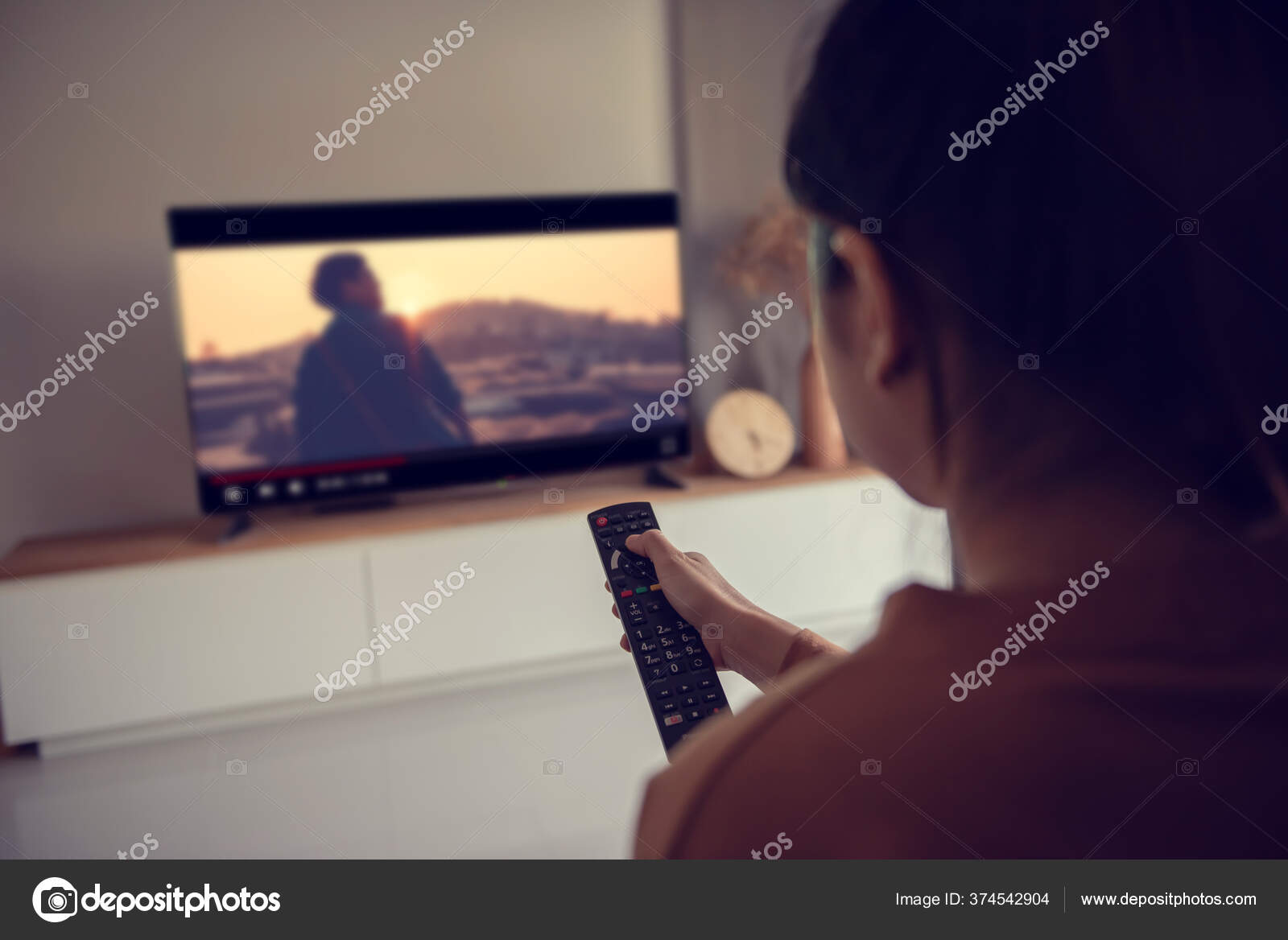Watching Using Remote Controller Stock Photo by ©oatawa 374542904