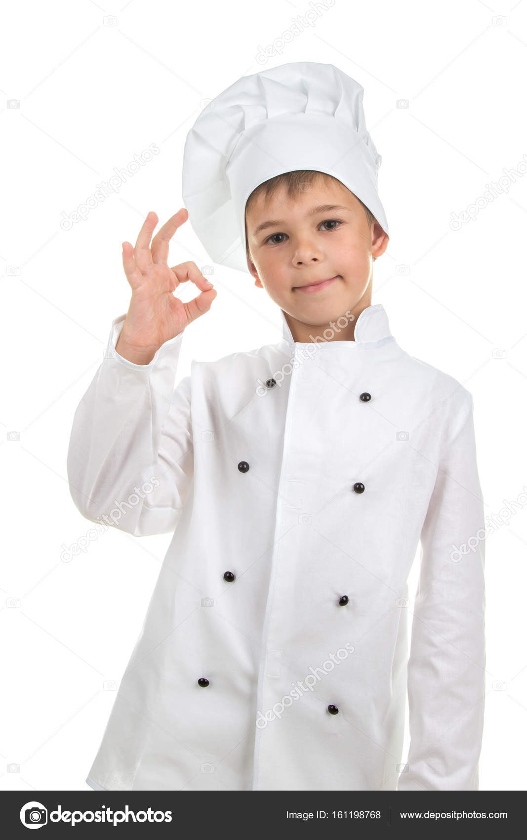 Cheerful handsome boy wearing chef uniform — Stock Photo © Cyndyk_IDS ...