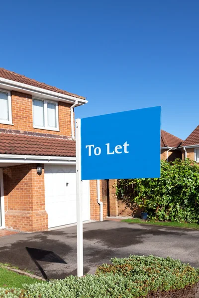 Blank Real Estate Sign and New Home — Stock Photo © Feverpitch #2368201