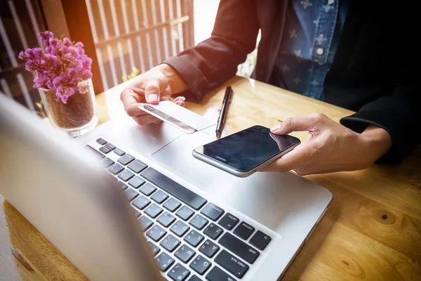 Woman inputting card information Stock Photo by ©snowing 130833412