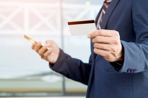 Man dialing number from visit card - Stock Image - Everypixel