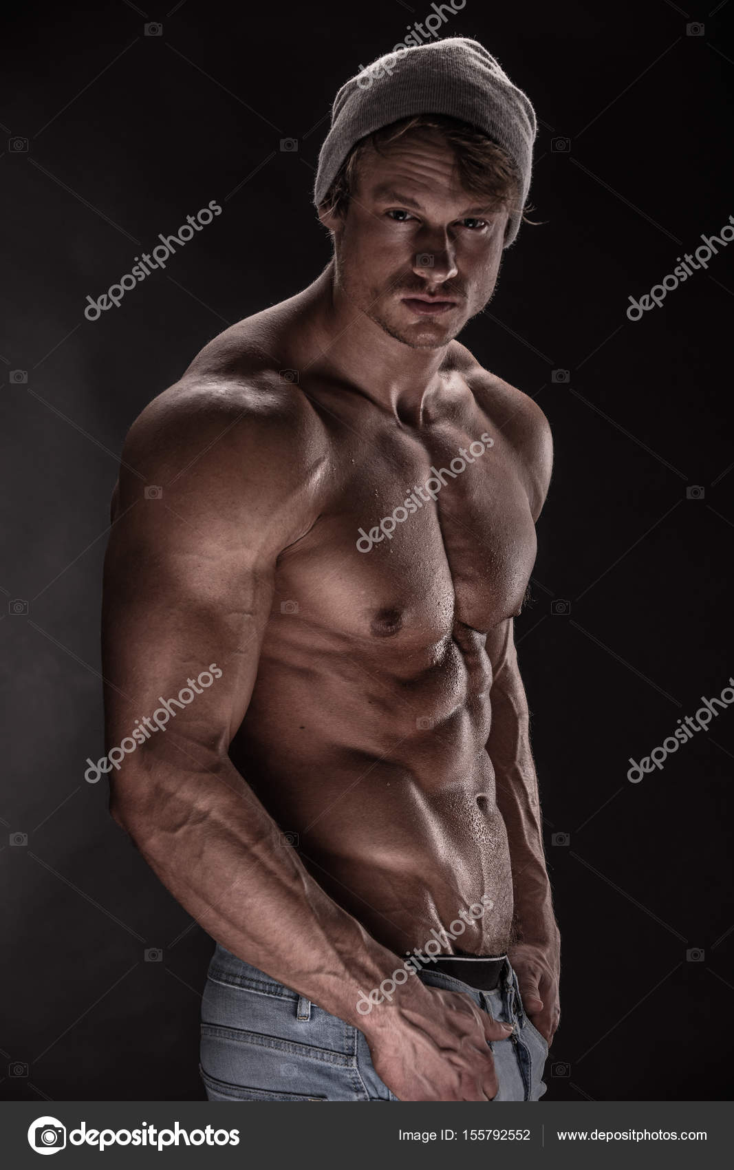 Strong Athletic Man Fitness Model on black background Stock Photo by ...