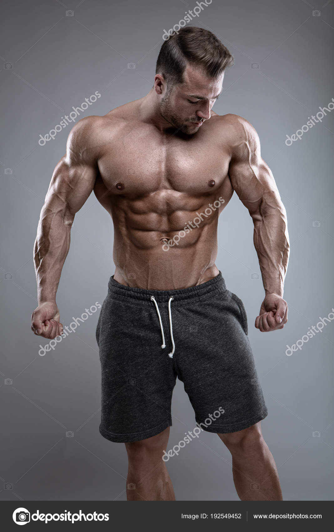 Strong Athletic Man shows body and abdominal muscles Stock Photo by ...