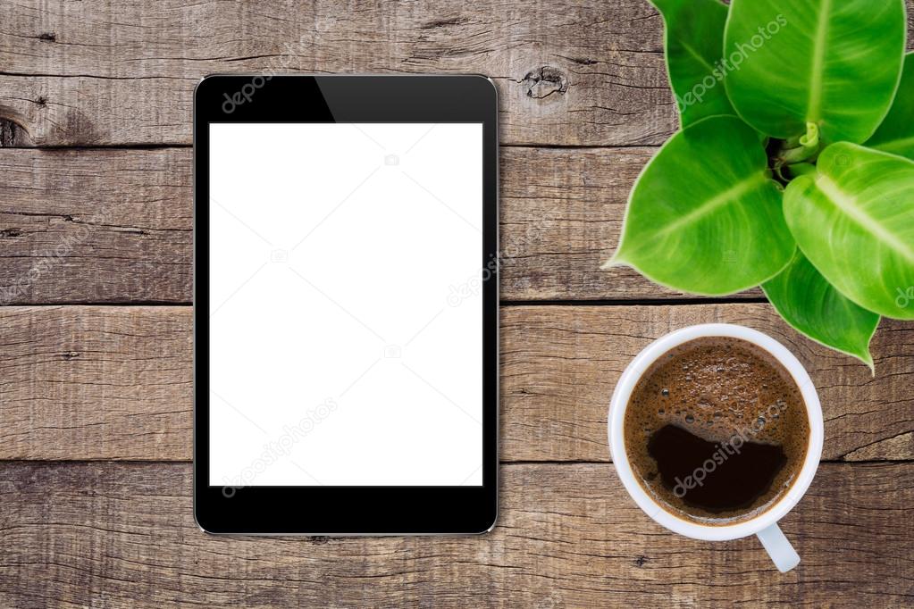Digital tablet on wood table top view, tablet white screen for a ...