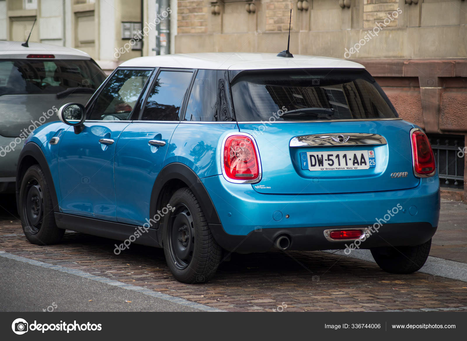 Rear view of blue mini cooper parked in the street – Stock Editorial ...