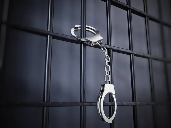 Metal prison bars with handcuffs on black background Stock Photo by ...