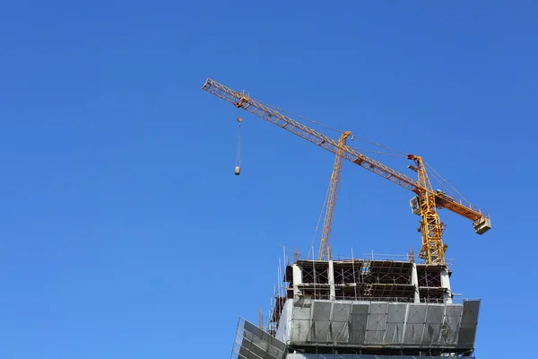 Hoisting tower crane Stock Photos, Royalty Free Hoisting tower crane ...