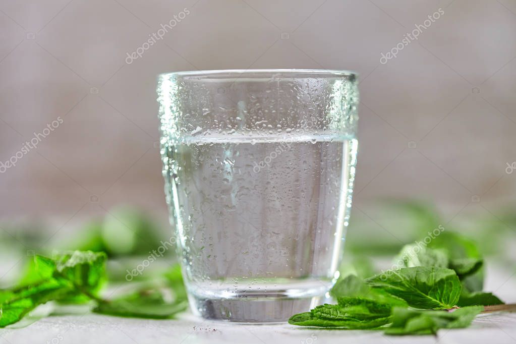 Glass of fresh cold water with mint on table — Stock Photo © petermayer ...