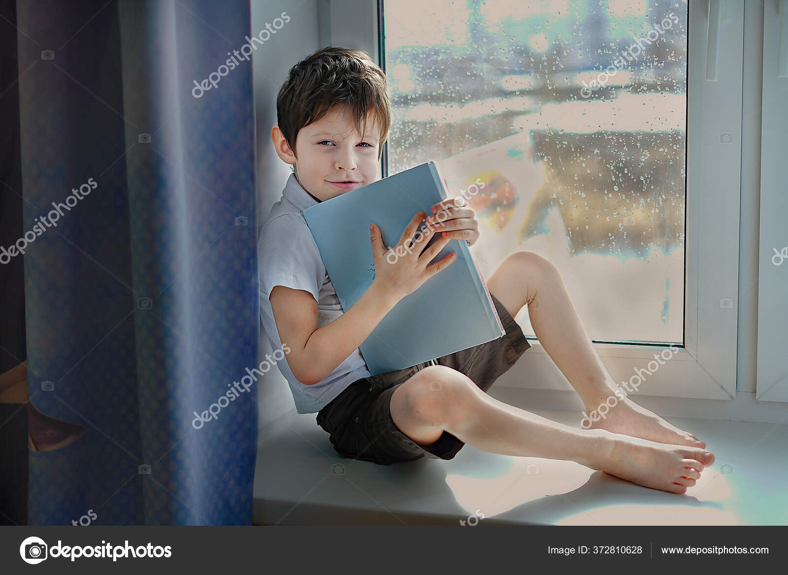 Boy Sits Window Blue Curtains Reads Book Bright Sun Shines — Stock ...