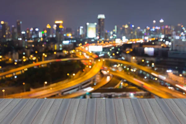 Opening wooden floor, Blurred lights overpass highway interchanged ...