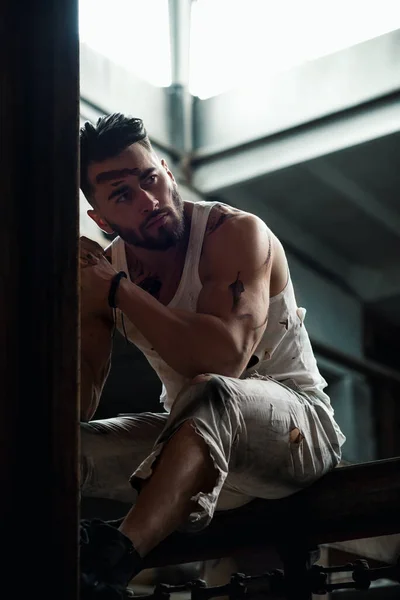 man resting after hard physical work, pumped up athletic body, nice ...