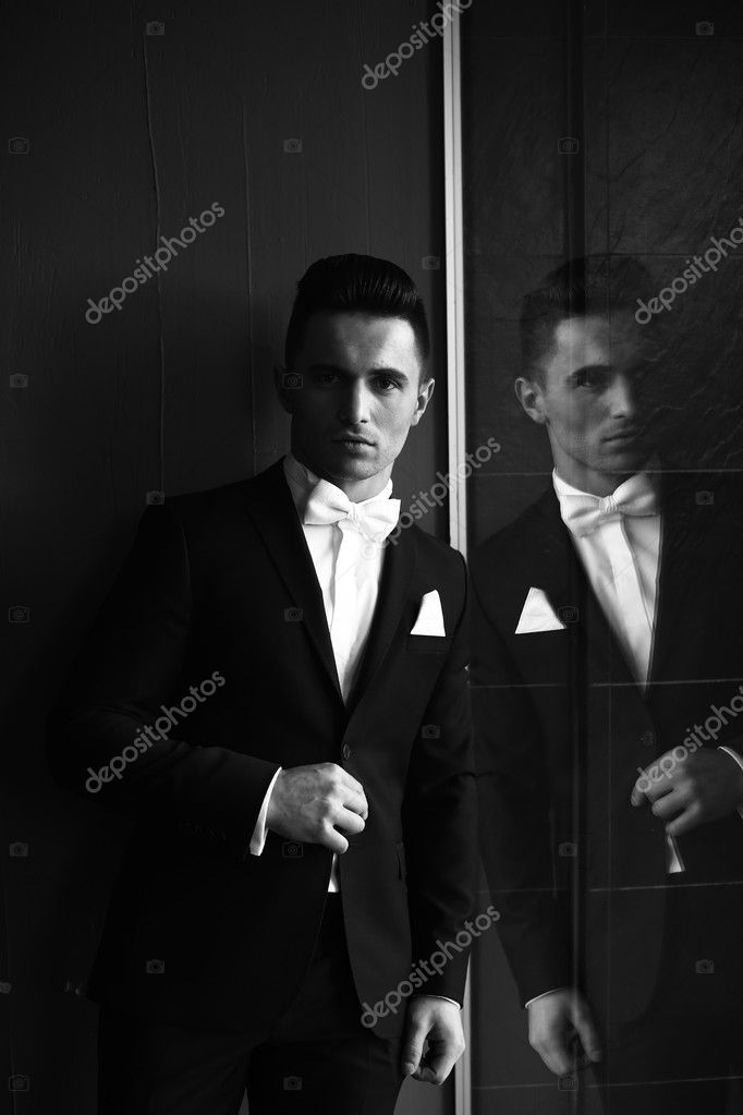 Elegant man reflects in mirror — Stock Photo © Tverdohlib.com #125173840