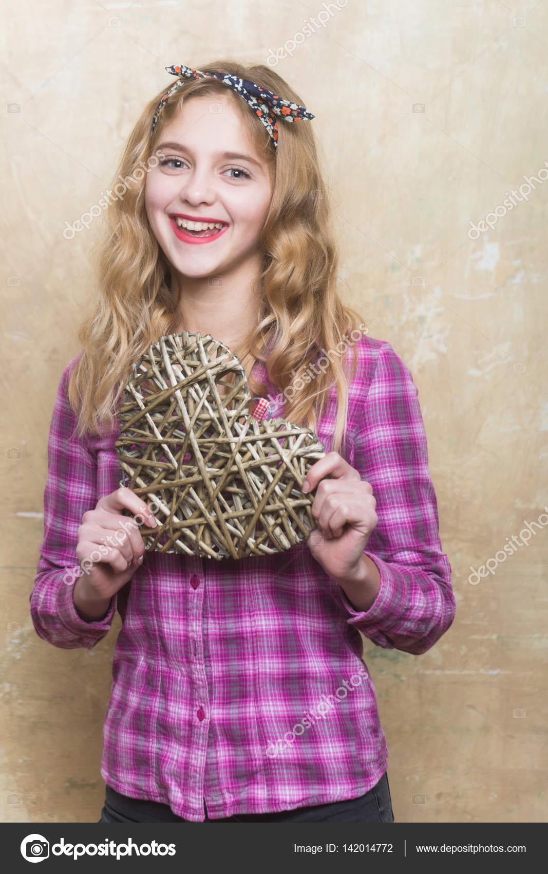Happy pretty girl with wicker heart for valentines day Stock Photo by ...