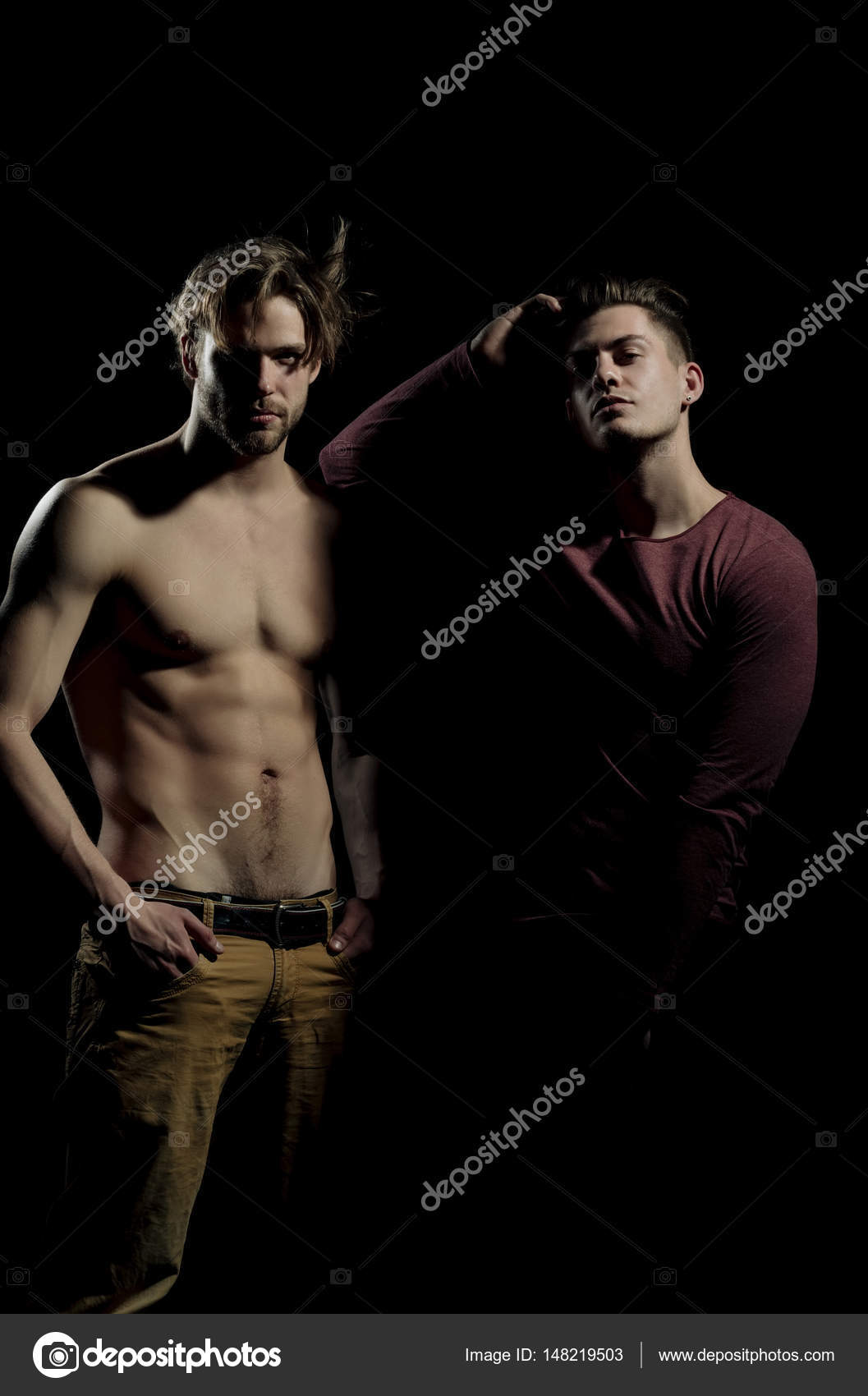 Two handsome men posing Stock Photo by ©Tverdohlib.com 148219503
