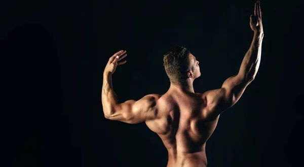Back view of black bodybuilder raising his hands up Stock Photo by ...