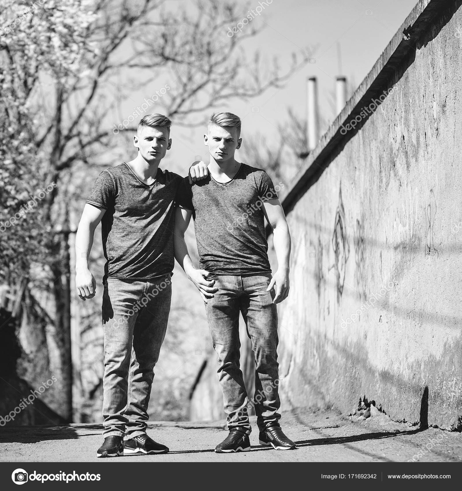 Twin brothers pose outdoor Stock Photo by ©Tverdohlib.com 171692342