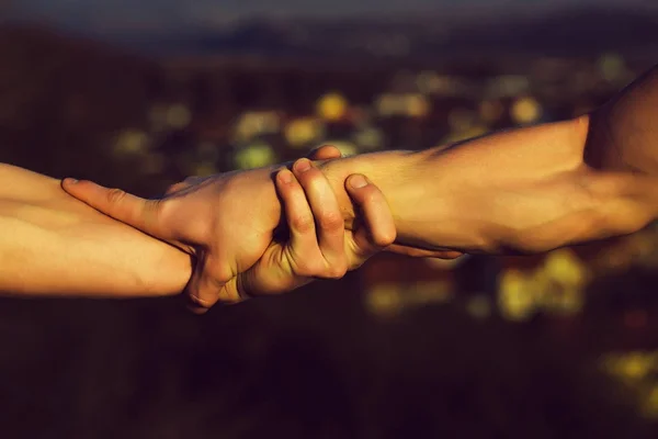 Two trength ands. Helping hand to a friend. Rescue or helping gesture of hands. Concept of ...