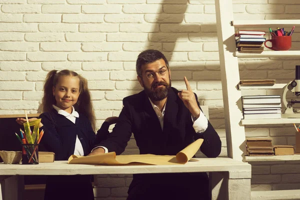 Happy kid having fun. Schoolgirl with shocked face and her sleeping ...