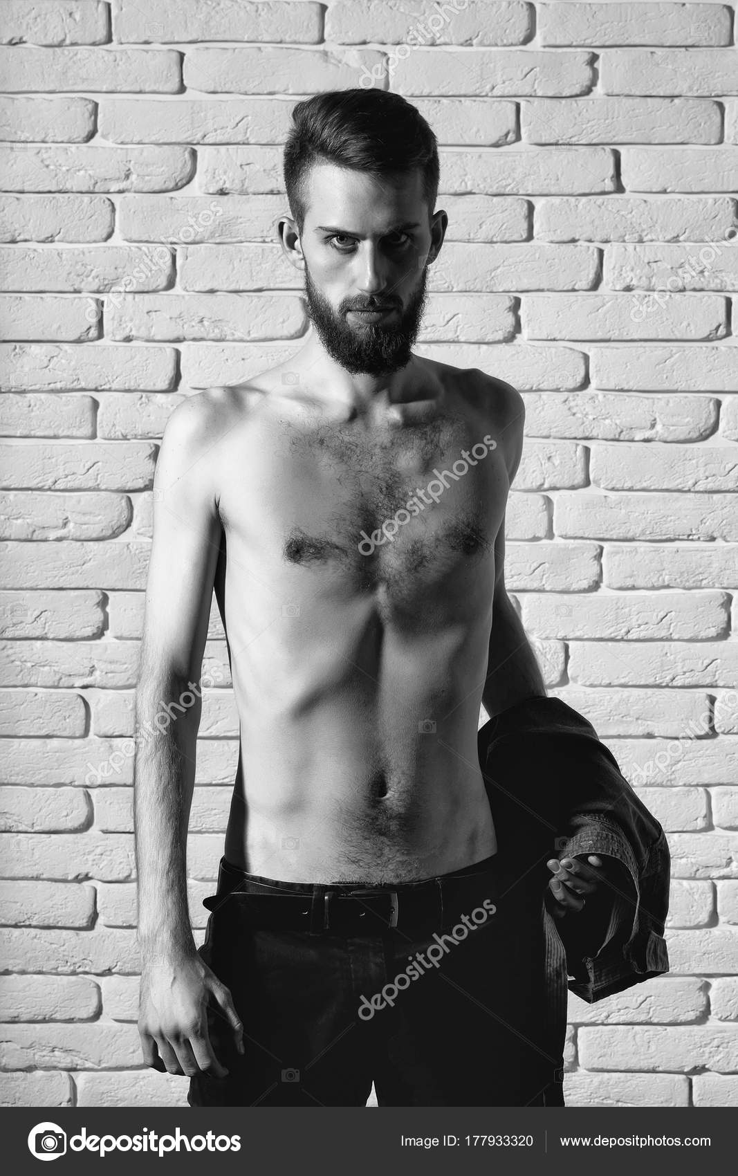 Slim bearded man with thin bare torso on brick background — Stock Photo ...