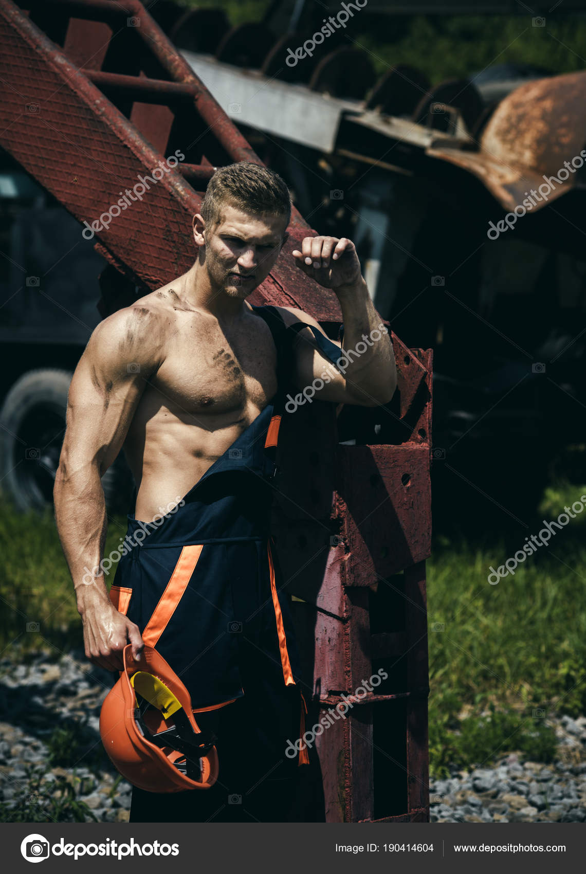 Sexy handyman concept. Muscular builder holds hard hat — Stock Photo ...