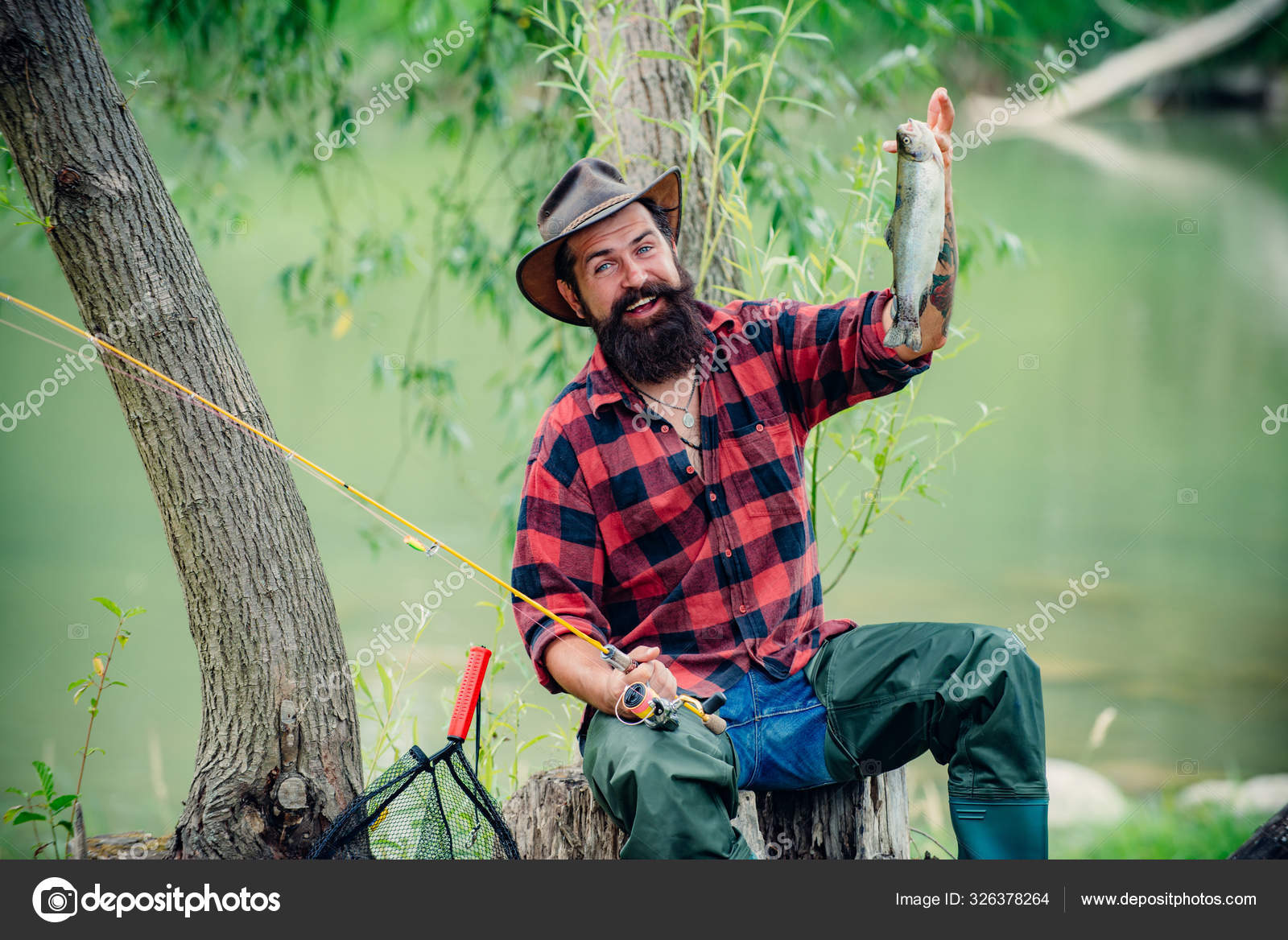 Fly fish hobby of man in checkered shirt. United with nature. Man ...