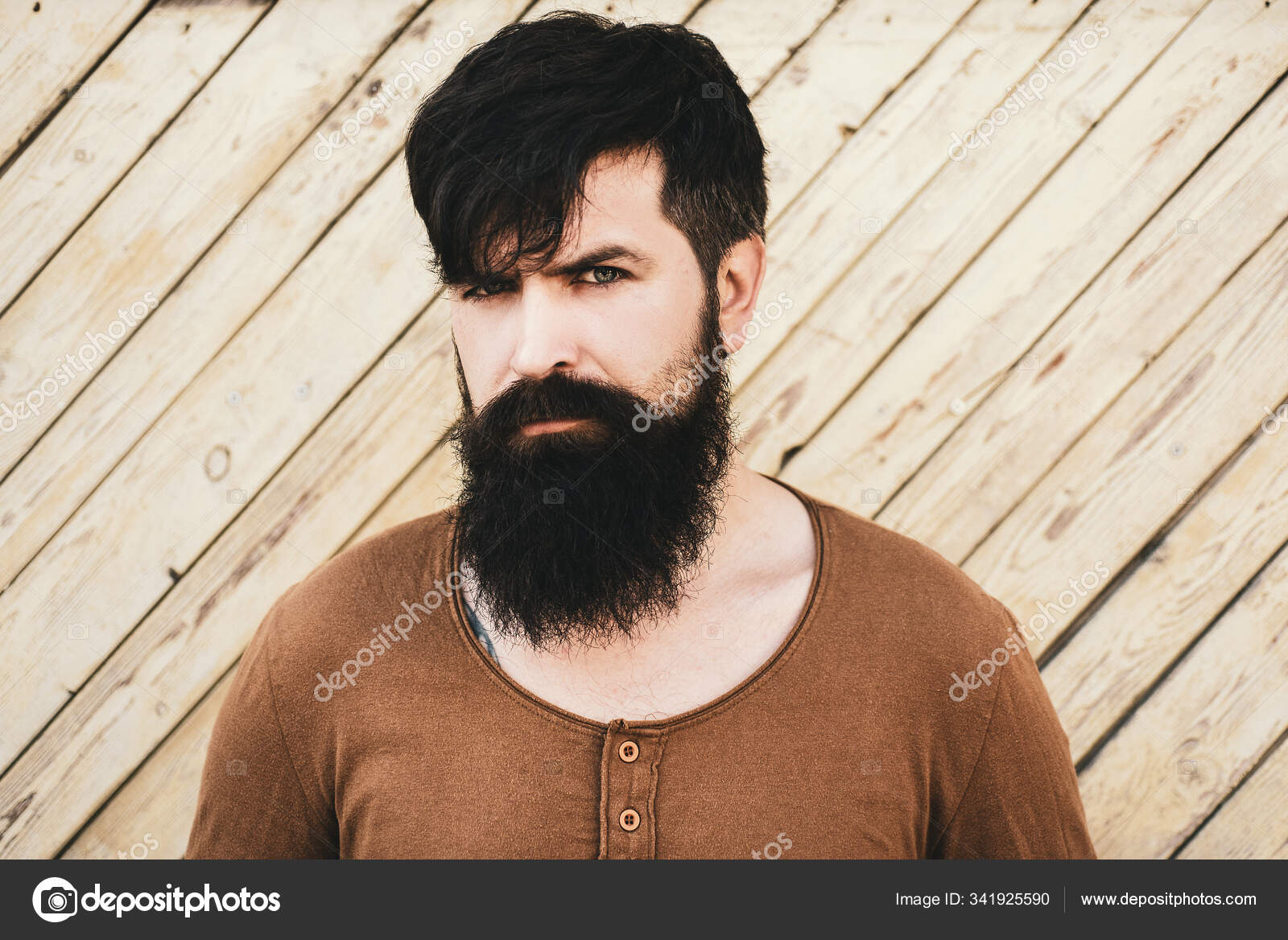 Guy with beard and modern hairstyle on street. Handsome male model ...
