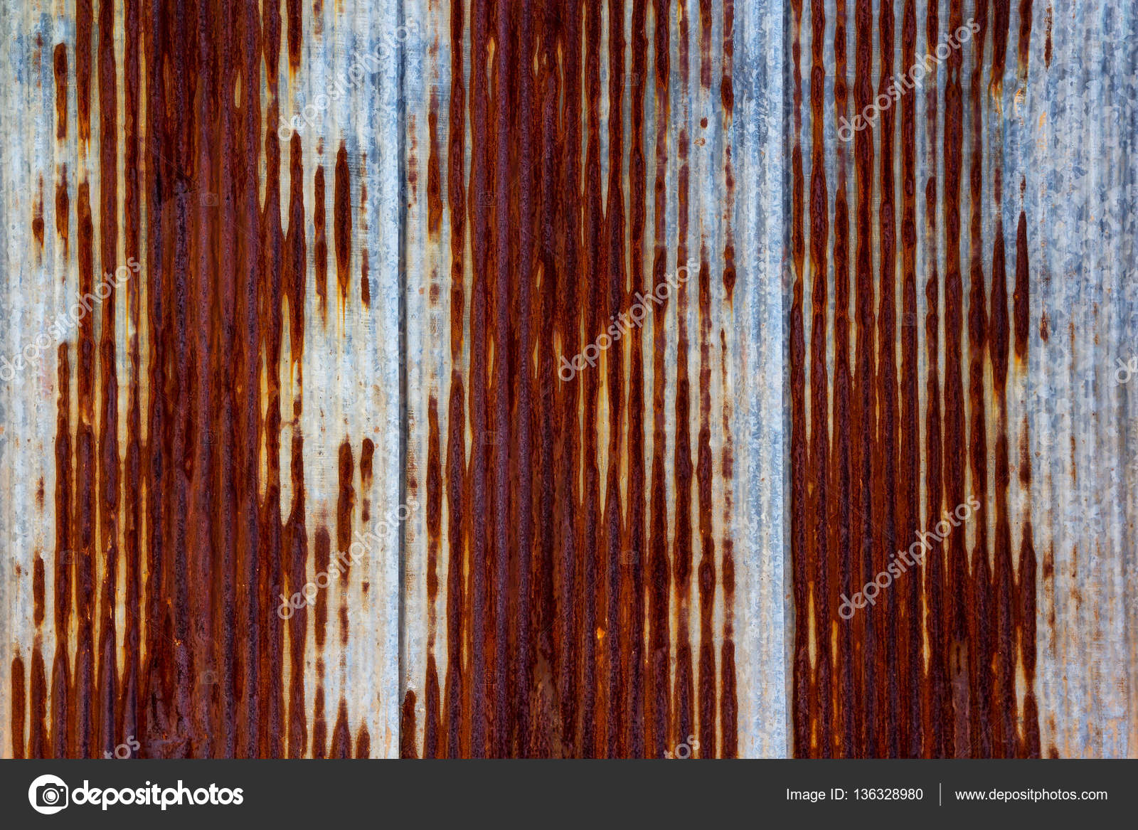 Rusting metal fencing or siding — Stock Photo © jpkirakun #136328980