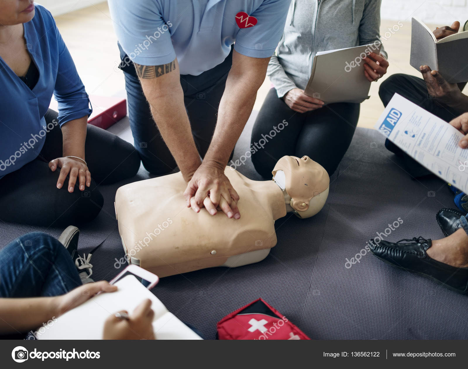 People learning CPR First Aid Training Stock Photo by ©Rawpixel 136562122