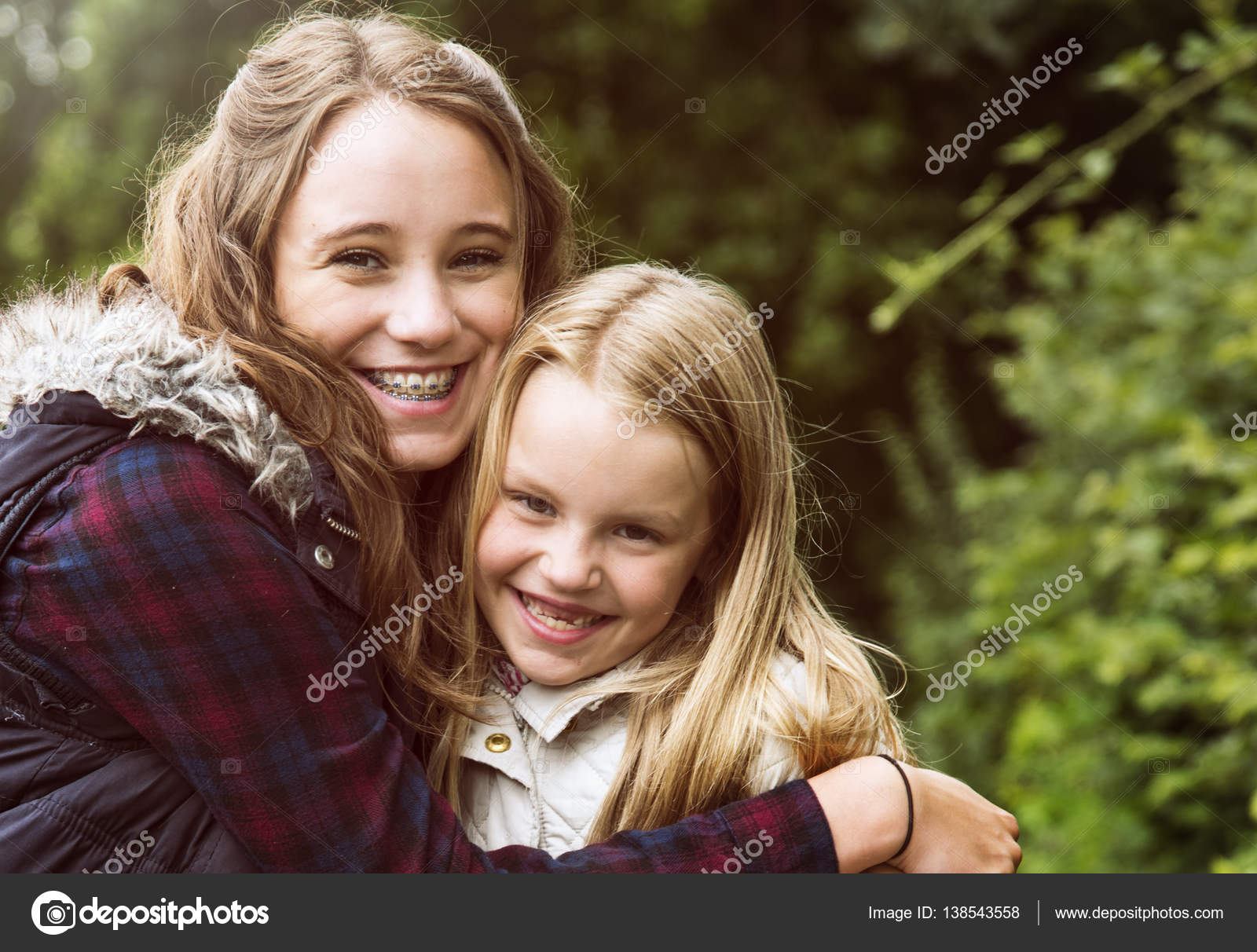 Two Sisters Hugging