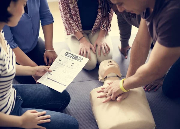 People learning CPR First Aid Training — Stock Photo © Rawpixel #140112142