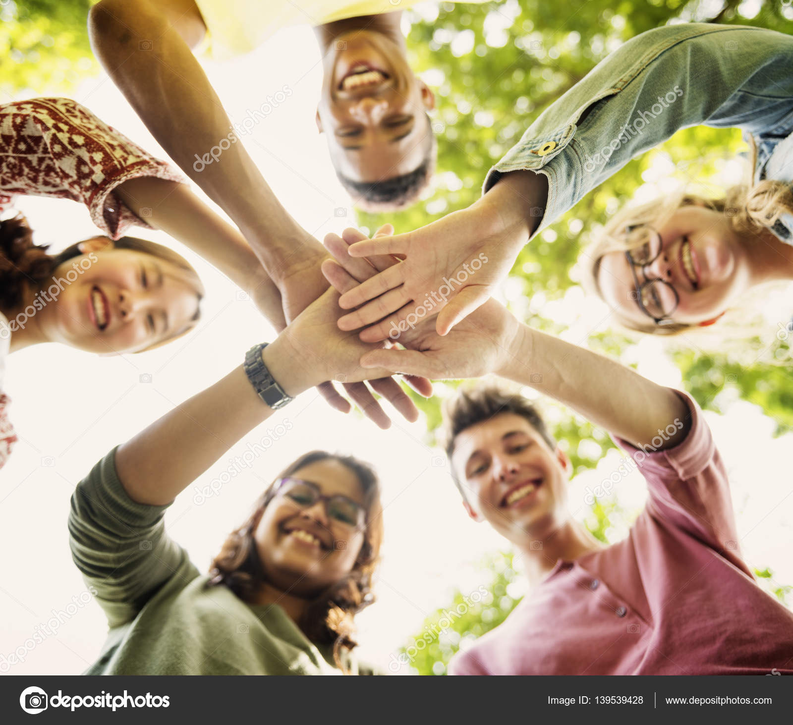 Students holding hands together Stock Photo by ©Rawpixel 139539428