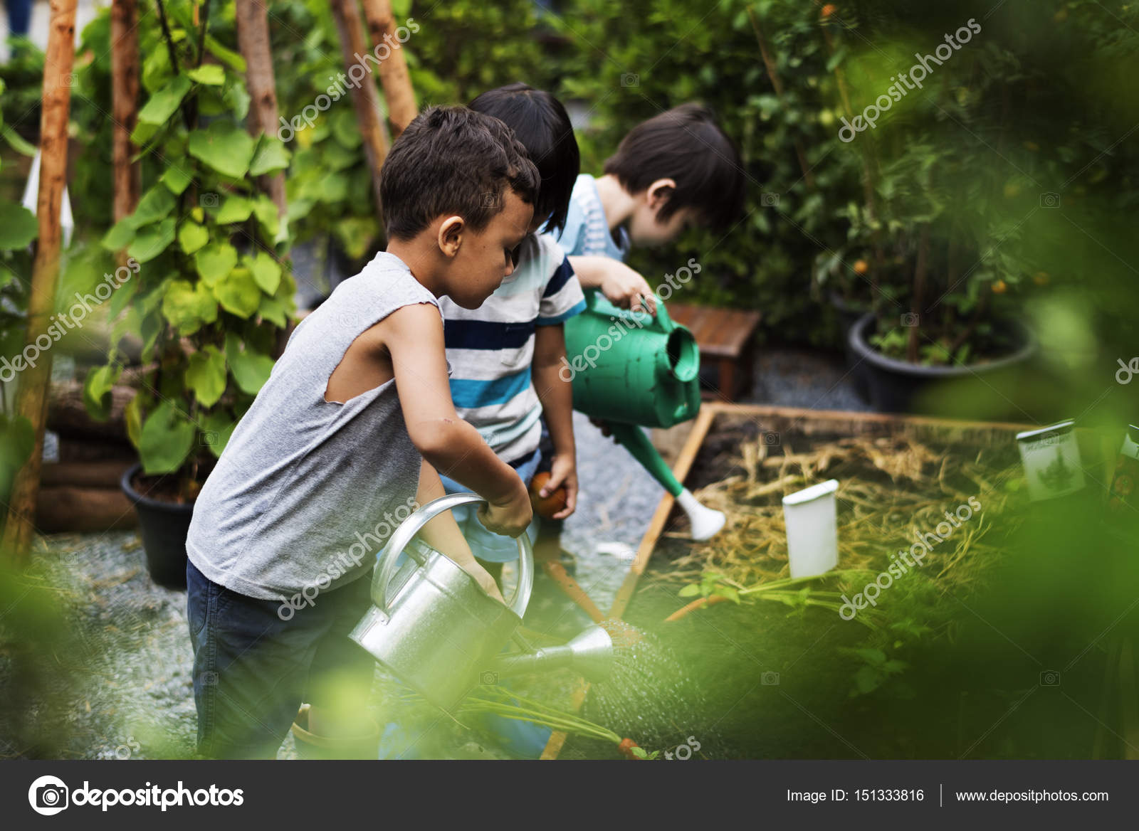 Kids watering plants — Stock Photo © Rawpixel #151333816