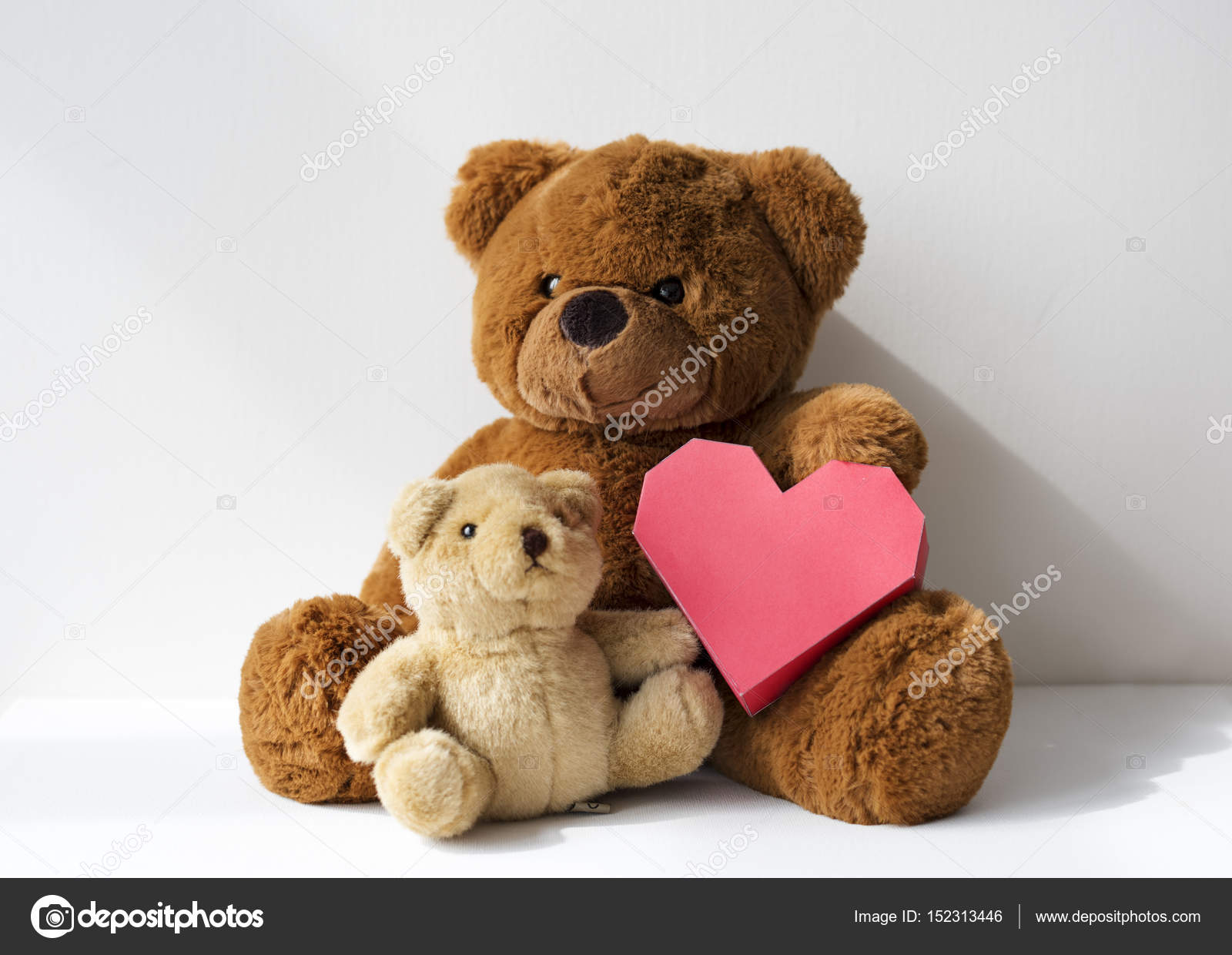 Two Teddy Bears Holding A Heart