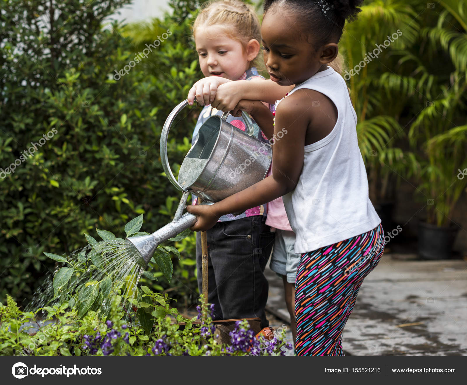 Kids Watering Flowers