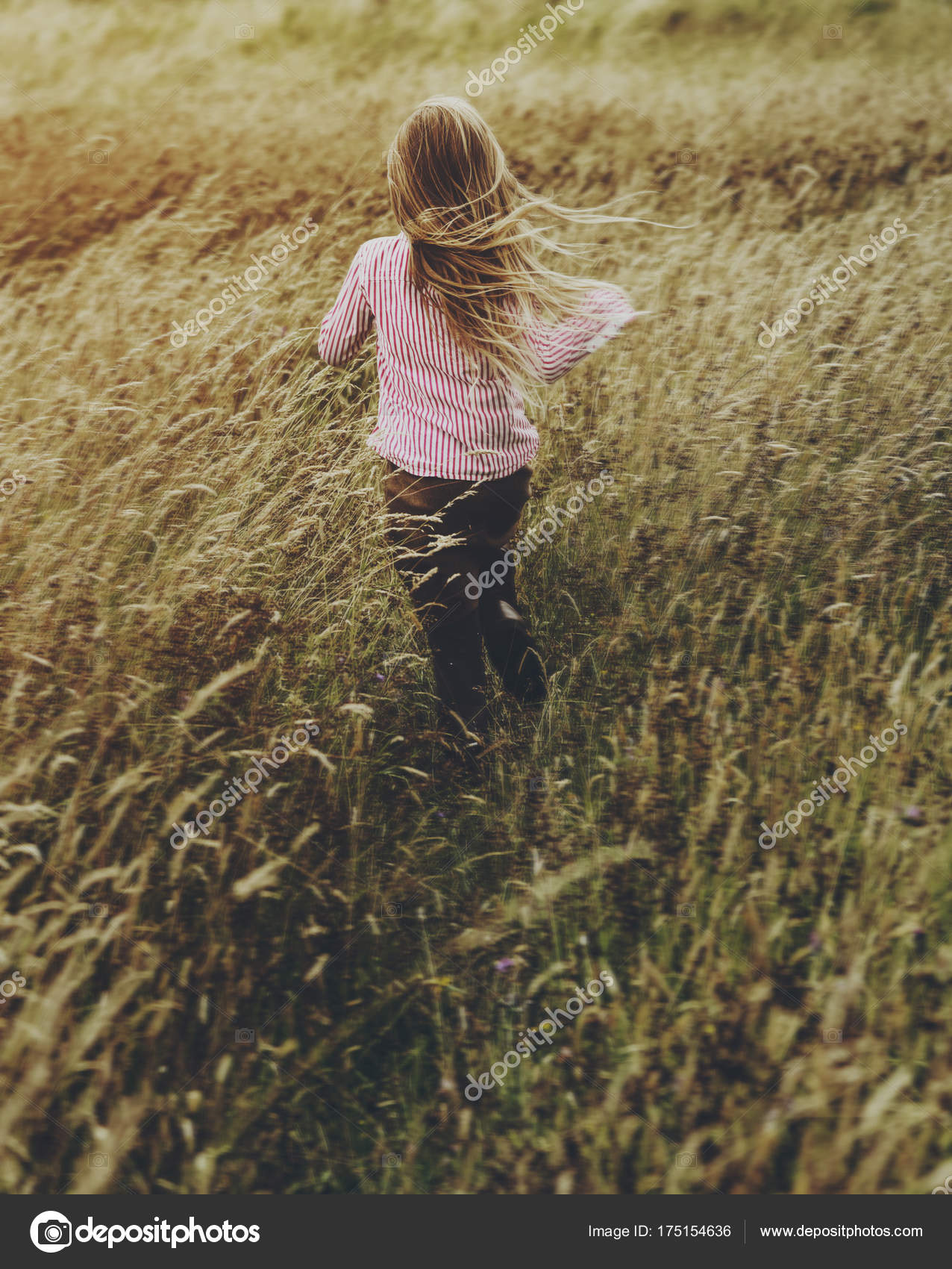 Little Girl Running In Field