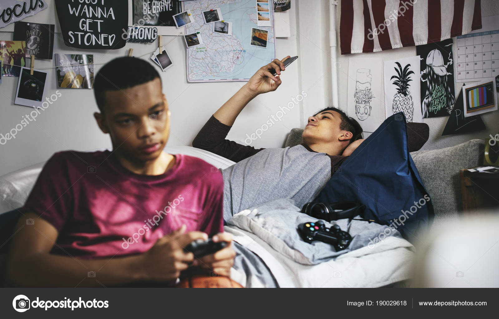 Teenage Boys Hanging Out Bedroom Playing Video Game Using Smartphone ... Teenage Boys Hanging Out Bedroom Playing Video Game Using Smartphone ...