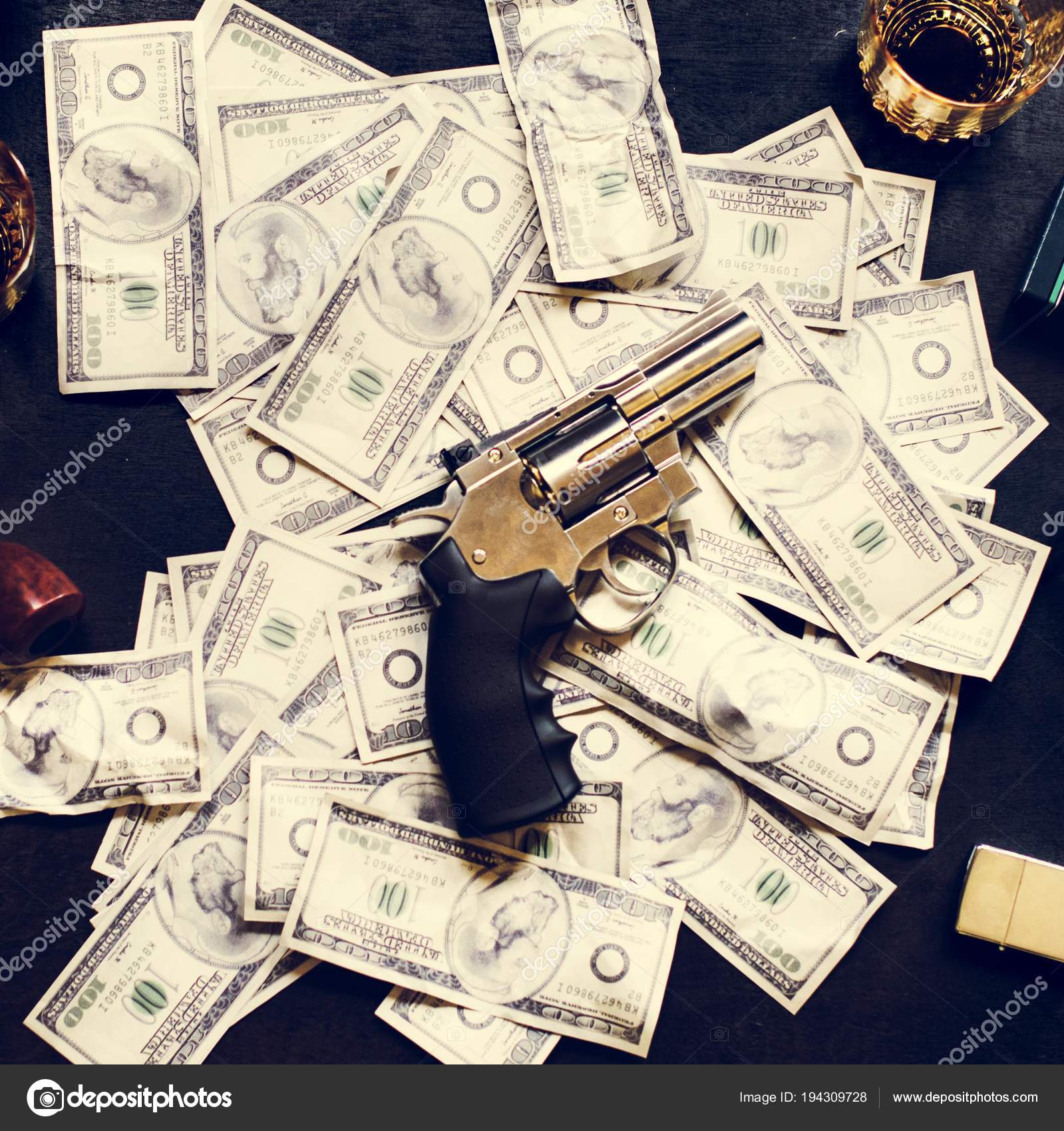 Money And Gun On Lap